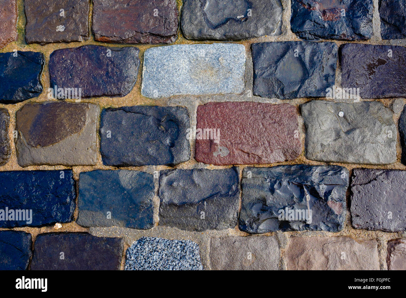 Stone texture abstract near the ocean with a wet and weathered surface ...