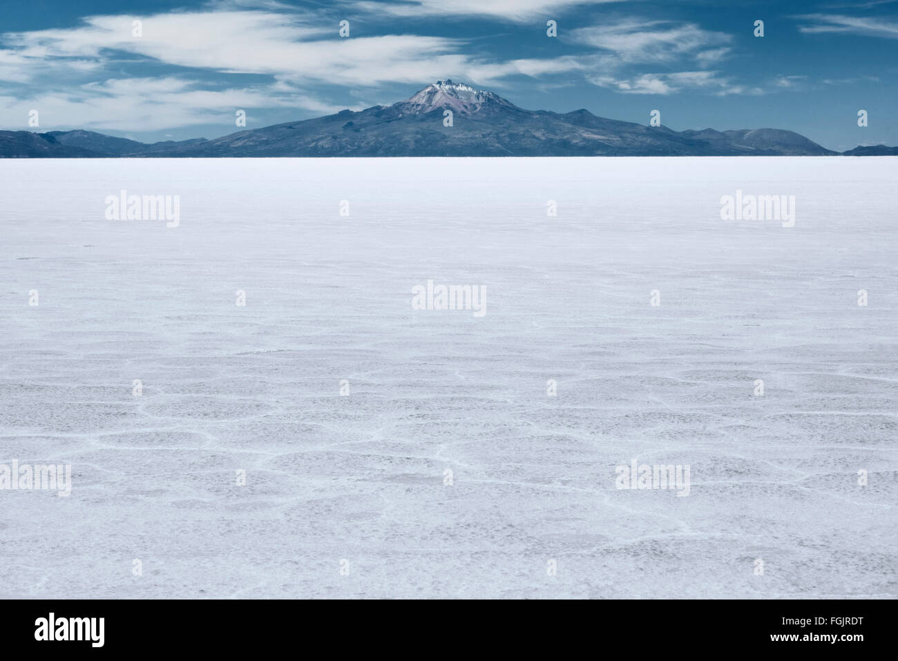 The world's largest salt flat and dormant volcano Tunupa at the far ...