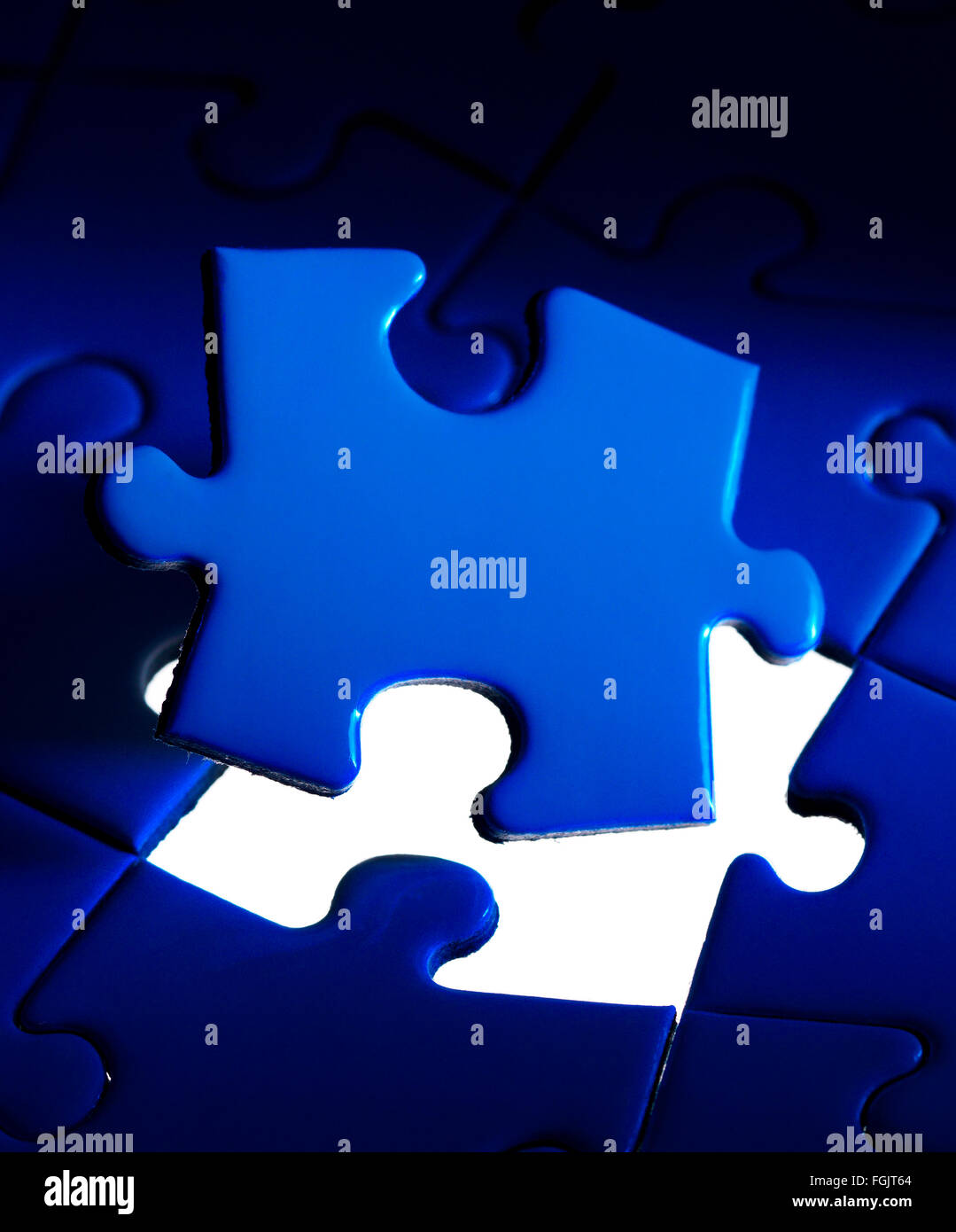 Jigsaw pieces with a white background Stock Photo - Alamy