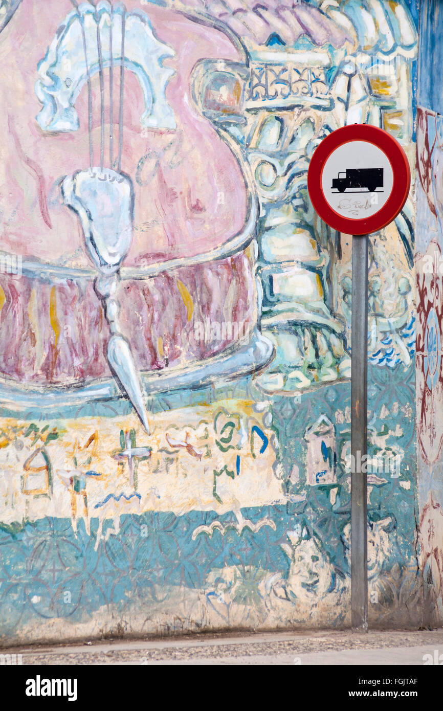 Truck lorry road traffic sign in front of street art mural murals on ...