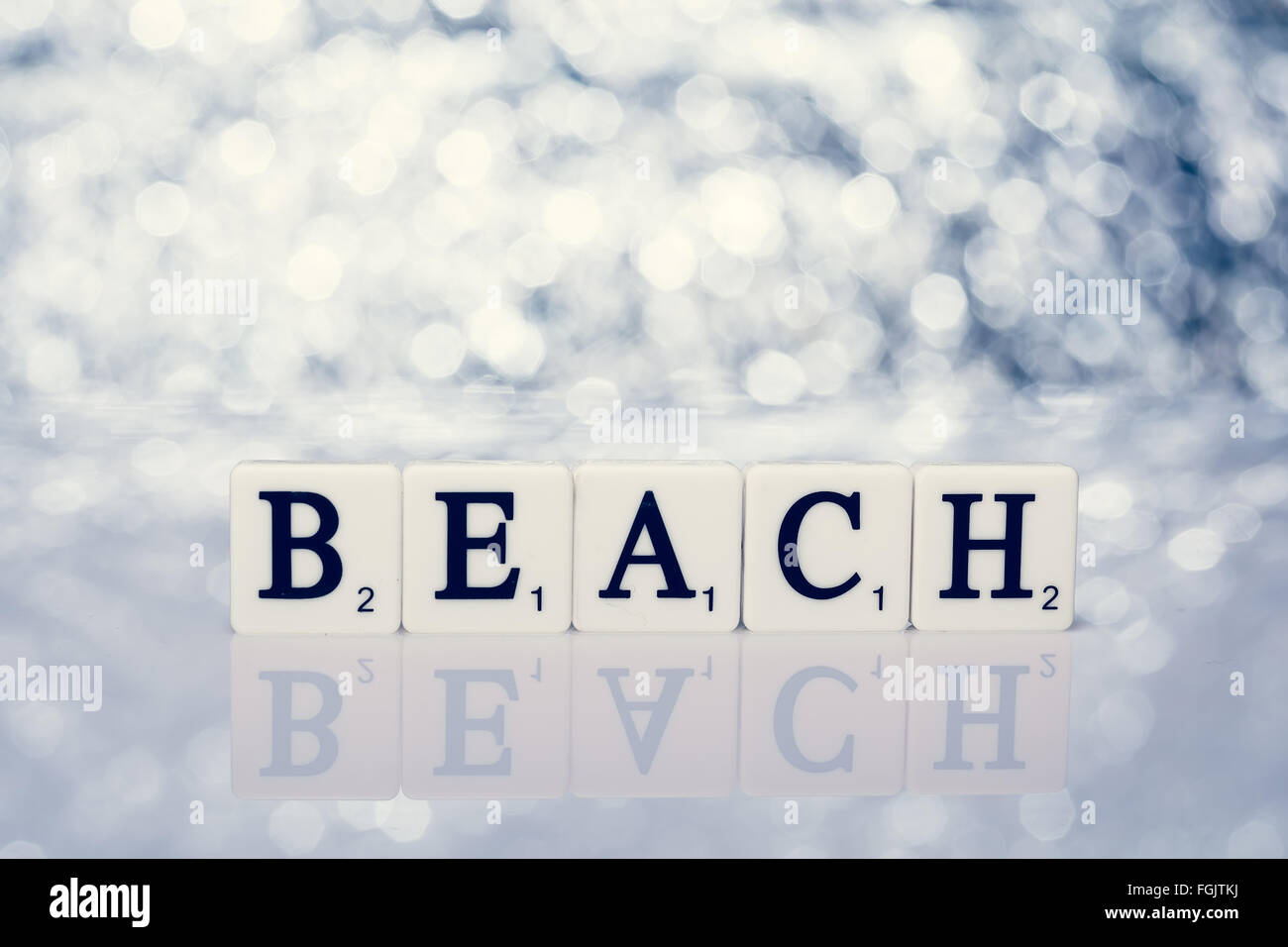Written word tiles with letters from the game Scrabble - beach Stock ...