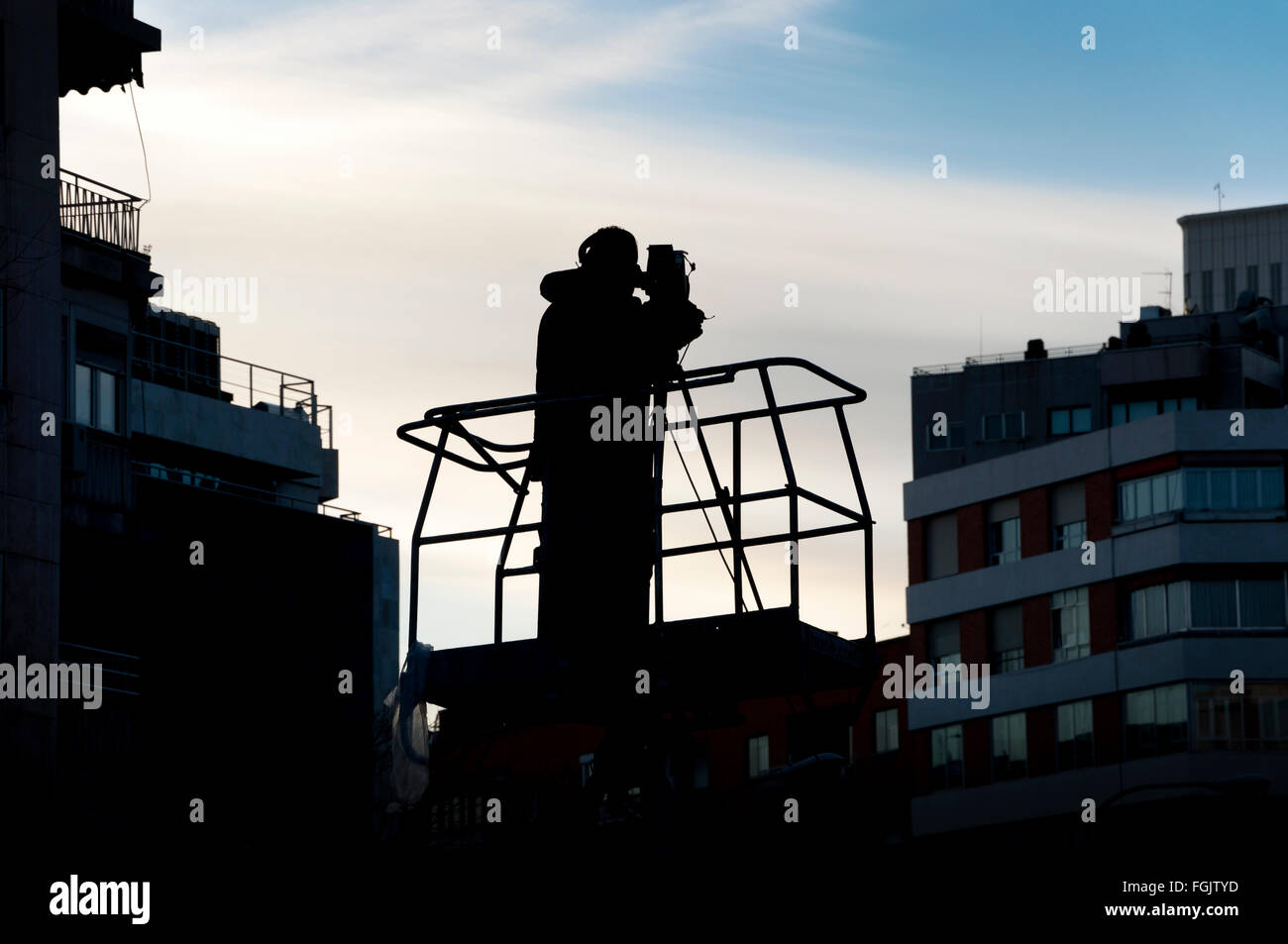 Cameraman working on an aerial work platform Stock Photo - Alamy