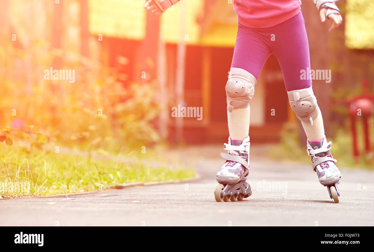 child rollerblading outdoors Stock Photo - Alamy