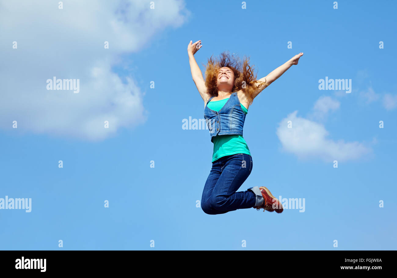 young woman jumping Stock Photo - Alamy