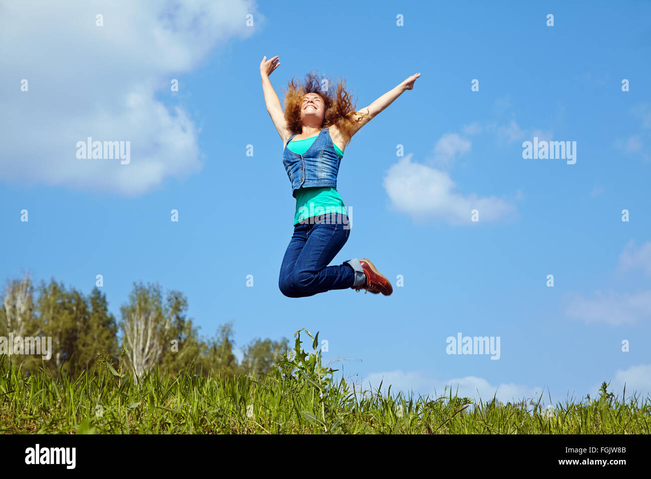 young woman jumping Stock Photo - Alamy