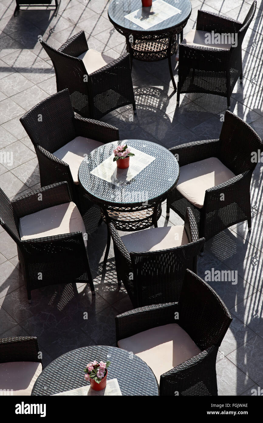 Cafe terrace with empty tables and chairs Stock Photo - Alamy