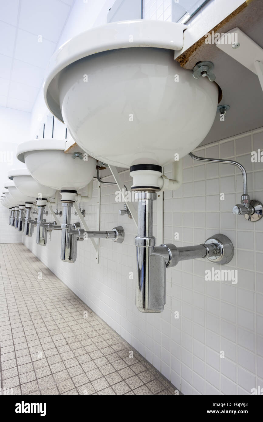 Public toilet sinks hi-res stock photography and images - Alamy