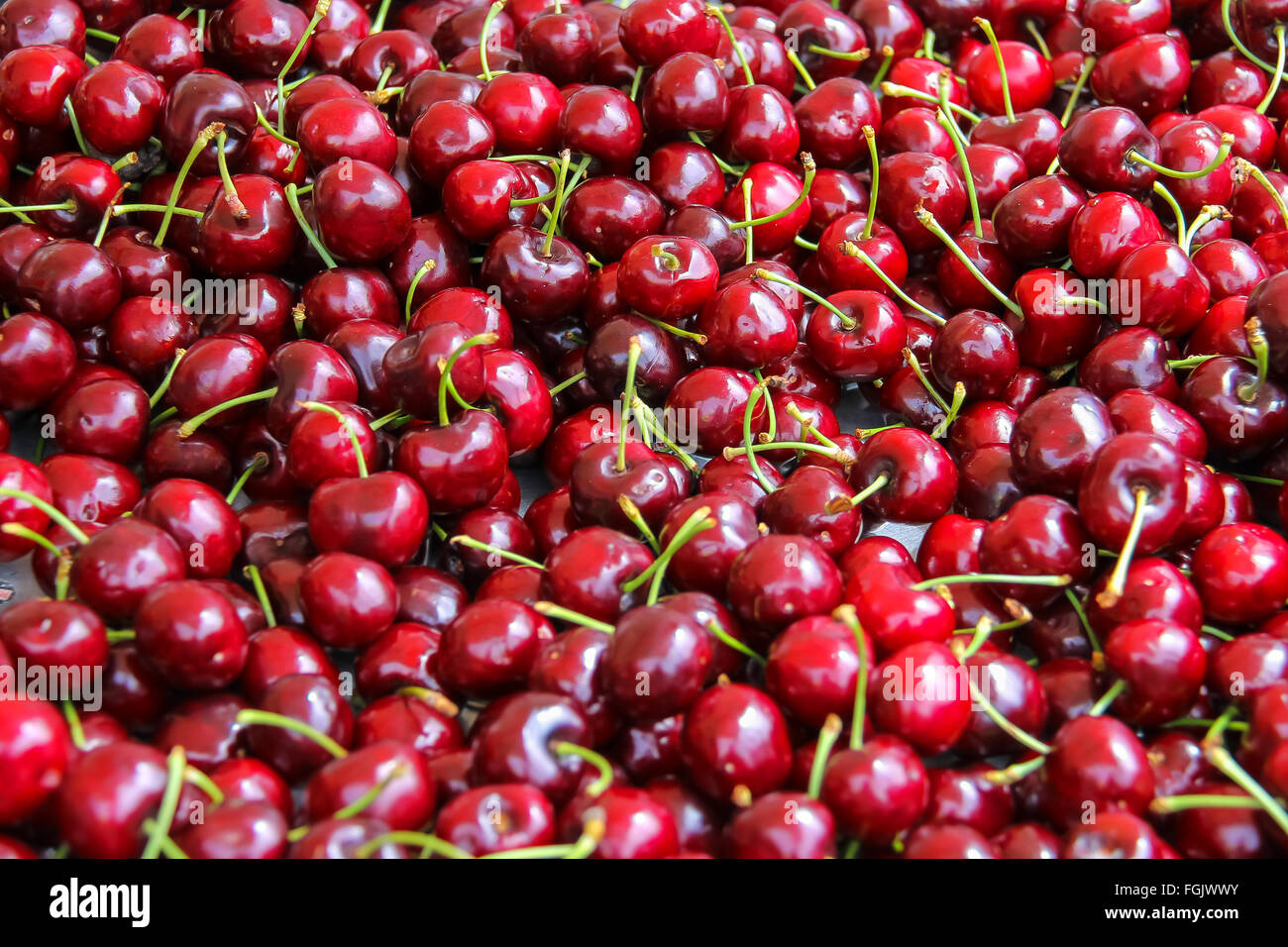Sweet red cherry background Stock Photo - Alamy