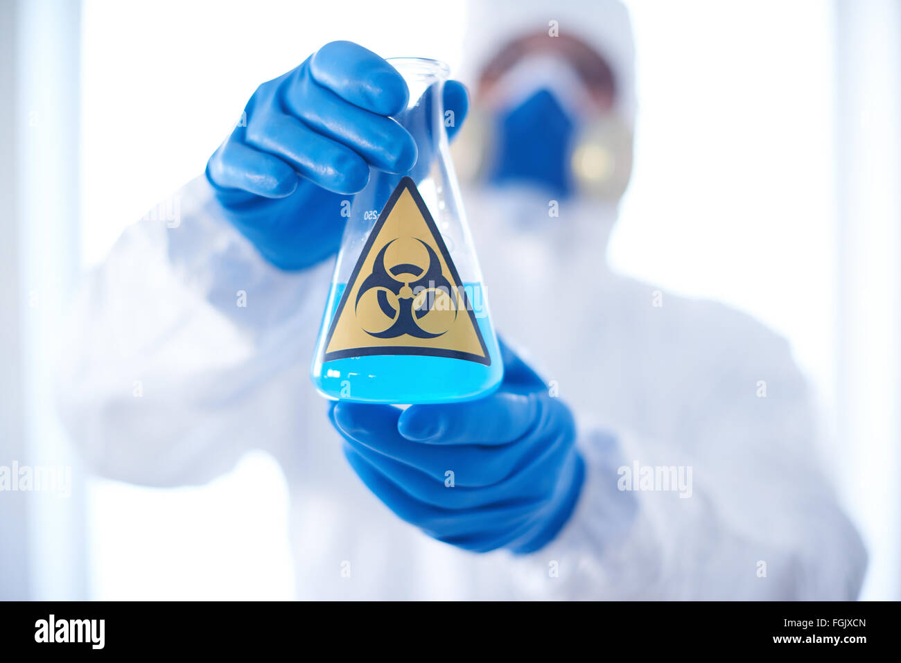 Gloved scientist hands holding glass tube with toxic fluid Stock Photo ...