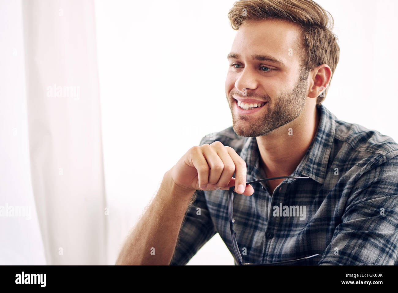 Happy business person looking off camera Stock Photo - Alamy