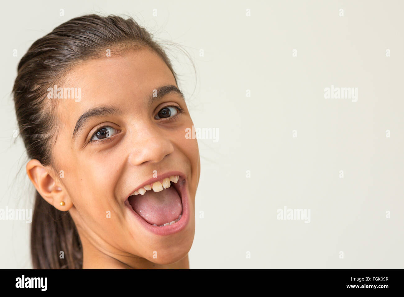 Smiling girl, side face Stock Photo - Alamy