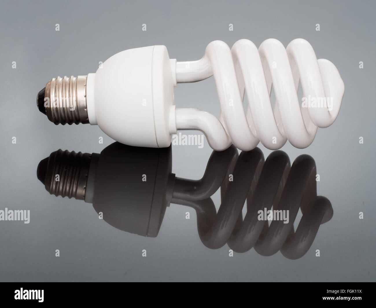 Energy saving light bulb with reflection Stock Photo - Alamy