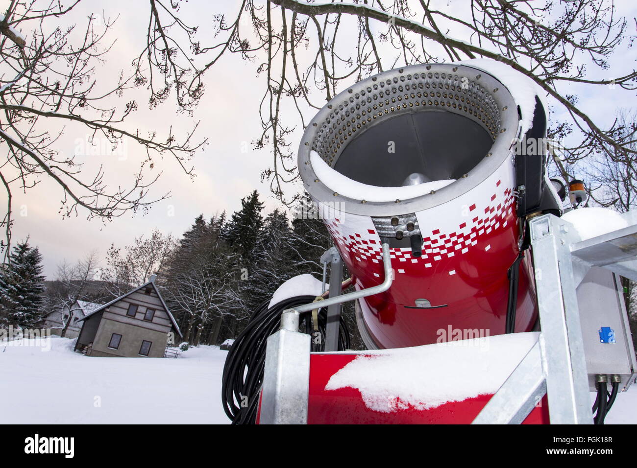 Snow making machine on piste at ski resort in snowy country Stock Photo ...