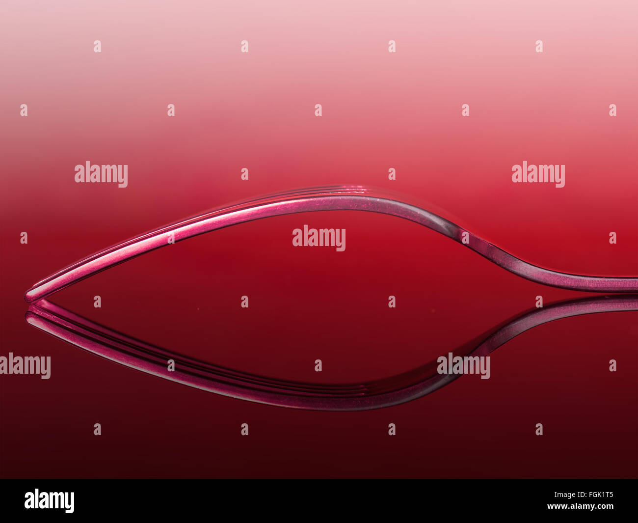 Pink fork abstract food or eating background, reflected Stock Photo - Alamy