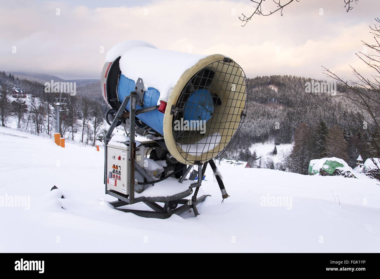 Snow making machine on piste at ski resort in snowy country Stock Photo ...