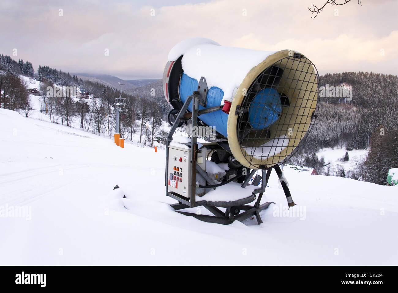 Snow making machine on piste at ski resort in snowy country Stock Photo ...
