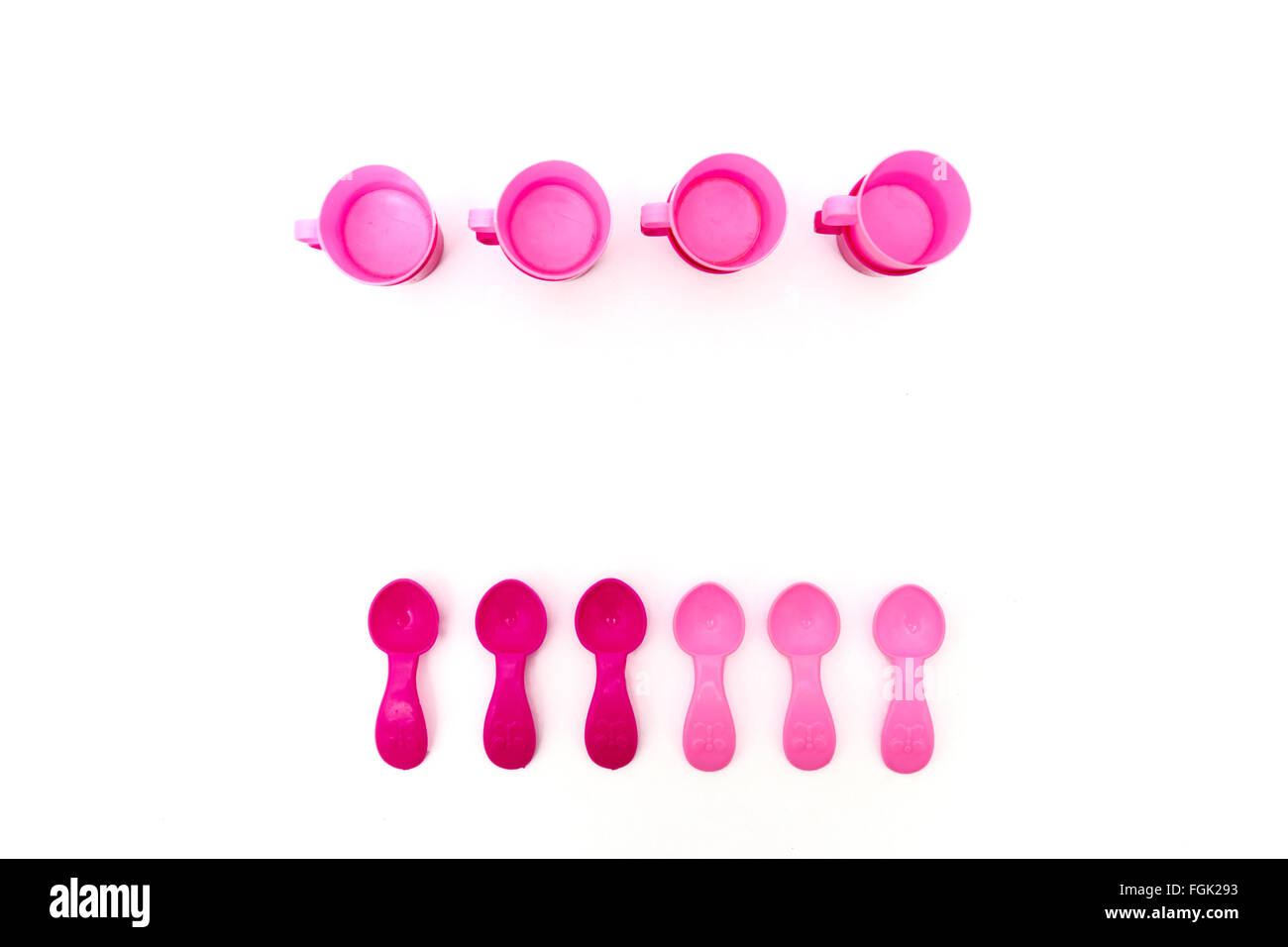 Collection of children's toys cups on white background Stock Photo - Alamy