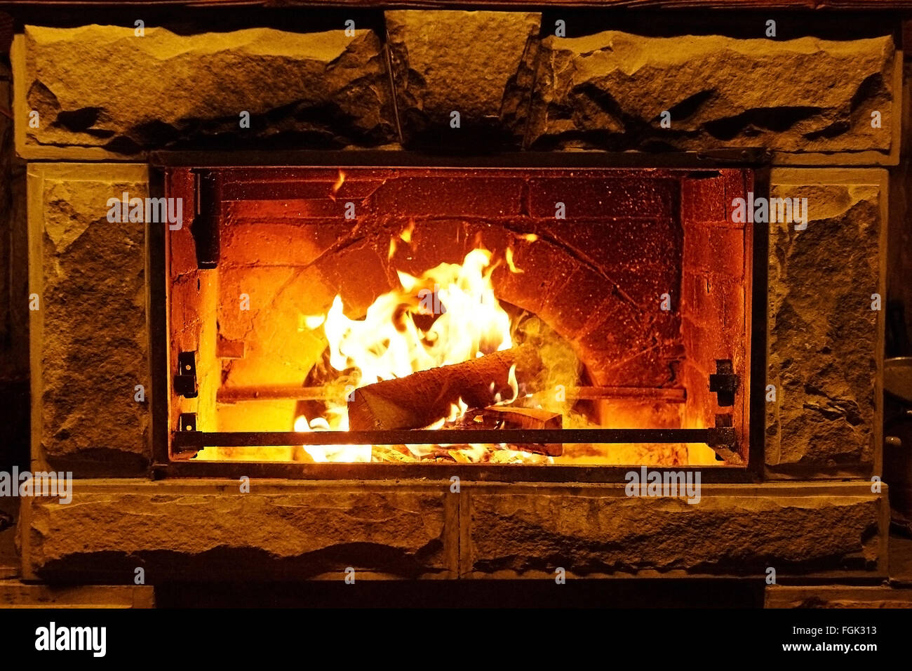 Fire burns in brick fireplace hi-res stock photography and images - Alamy