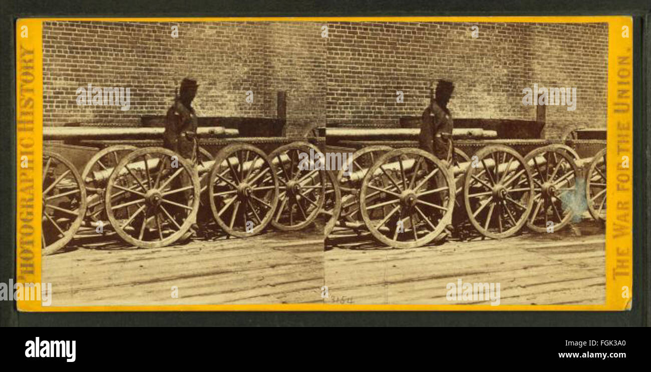 A stereoscopic photograph of captured brass Howitzer guns displayed at ...