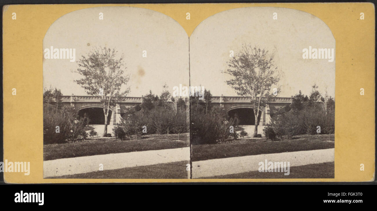 A photograph by William M. Chase showing an archway over a footpath in ...