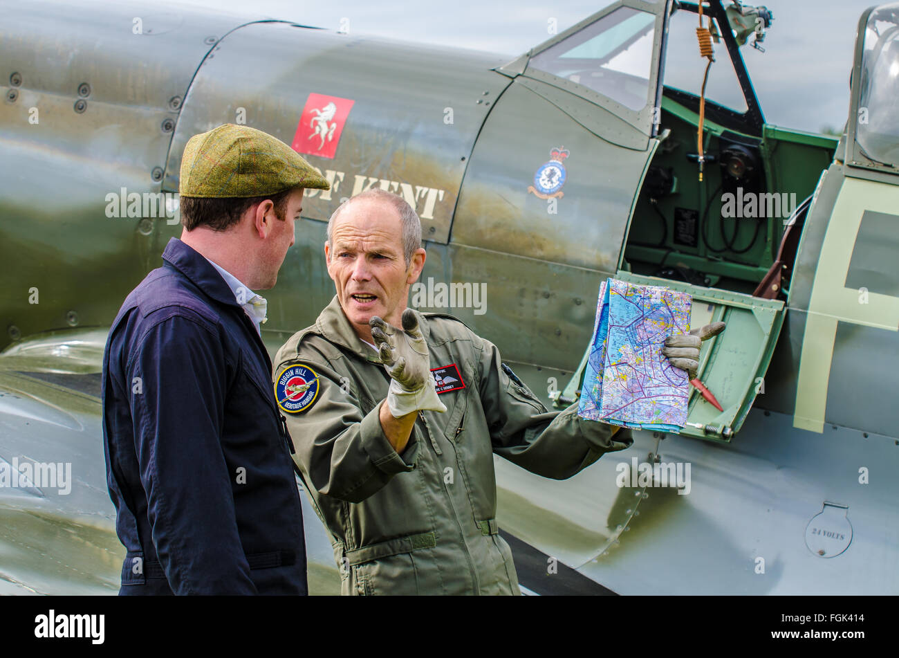 Pilots Richard Grace and Clive Denney plan their maneuvers for an air ...