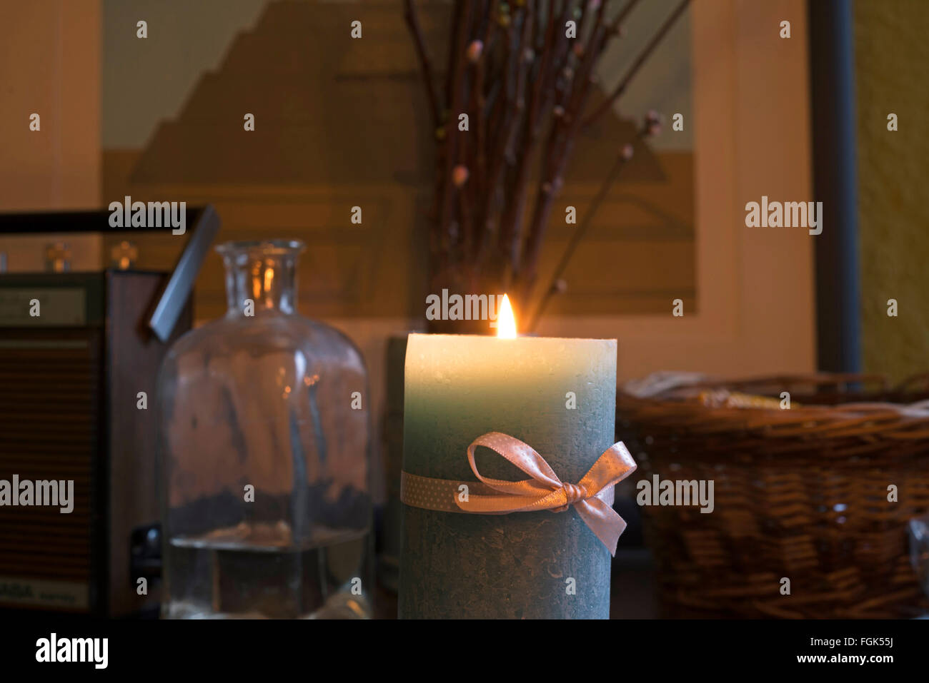 Candle on a kitchen table Stock Photo - Alamy