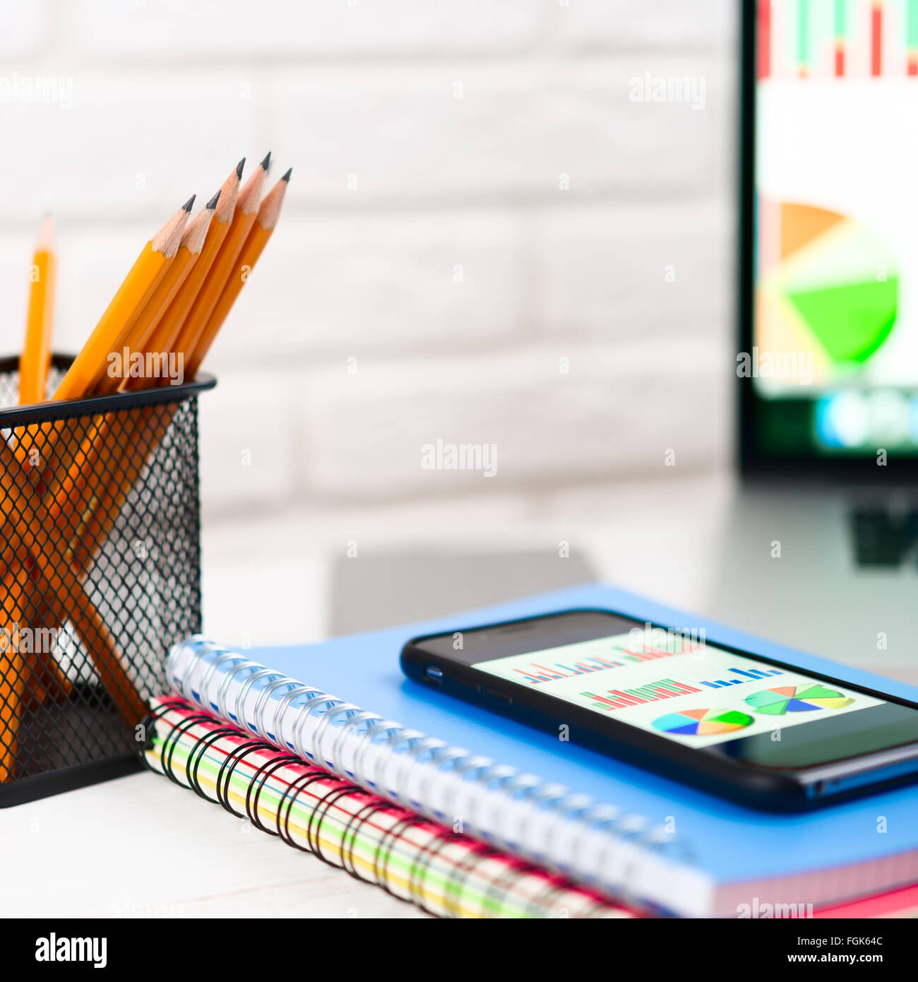 Workplace with notebook , laptop, pencils on a light background Stock ...
