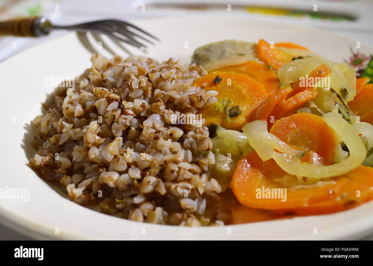 Fish with buckwheat and vegetables Stock Photo - Alamy