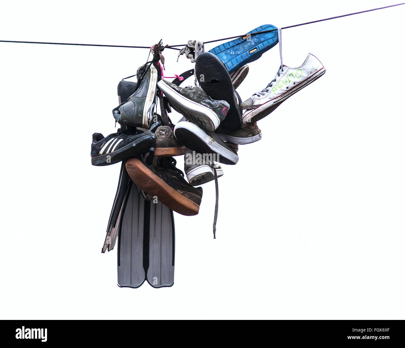 Collection Of Trainers and Flippers hanging from a telephone line ...
