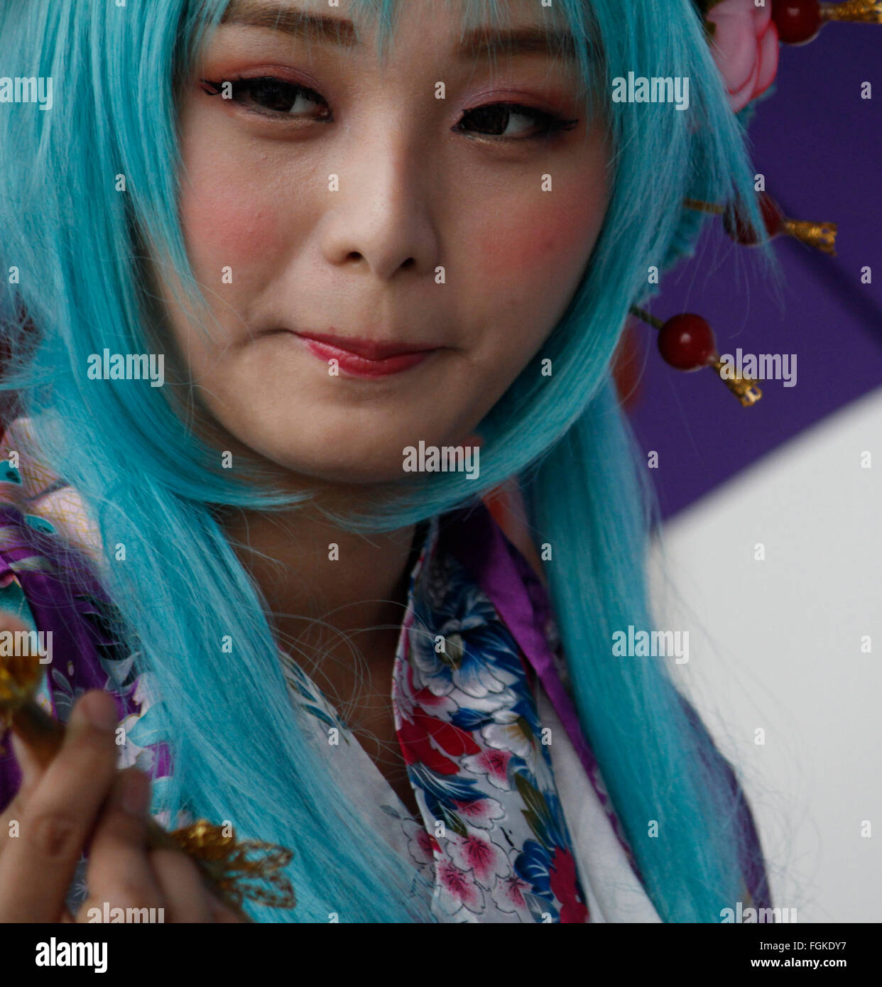 Pasay City, Philippines. 20th Feb, 2016. A cosplayer smiles for a ...