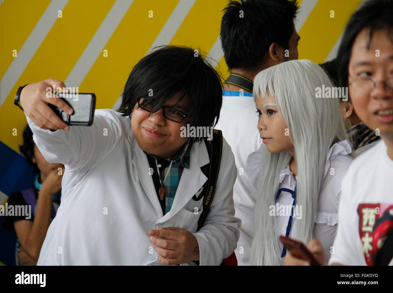 Pasay City, Philippines. 20th Feb, 2016. Cosplayers take a selfie ...