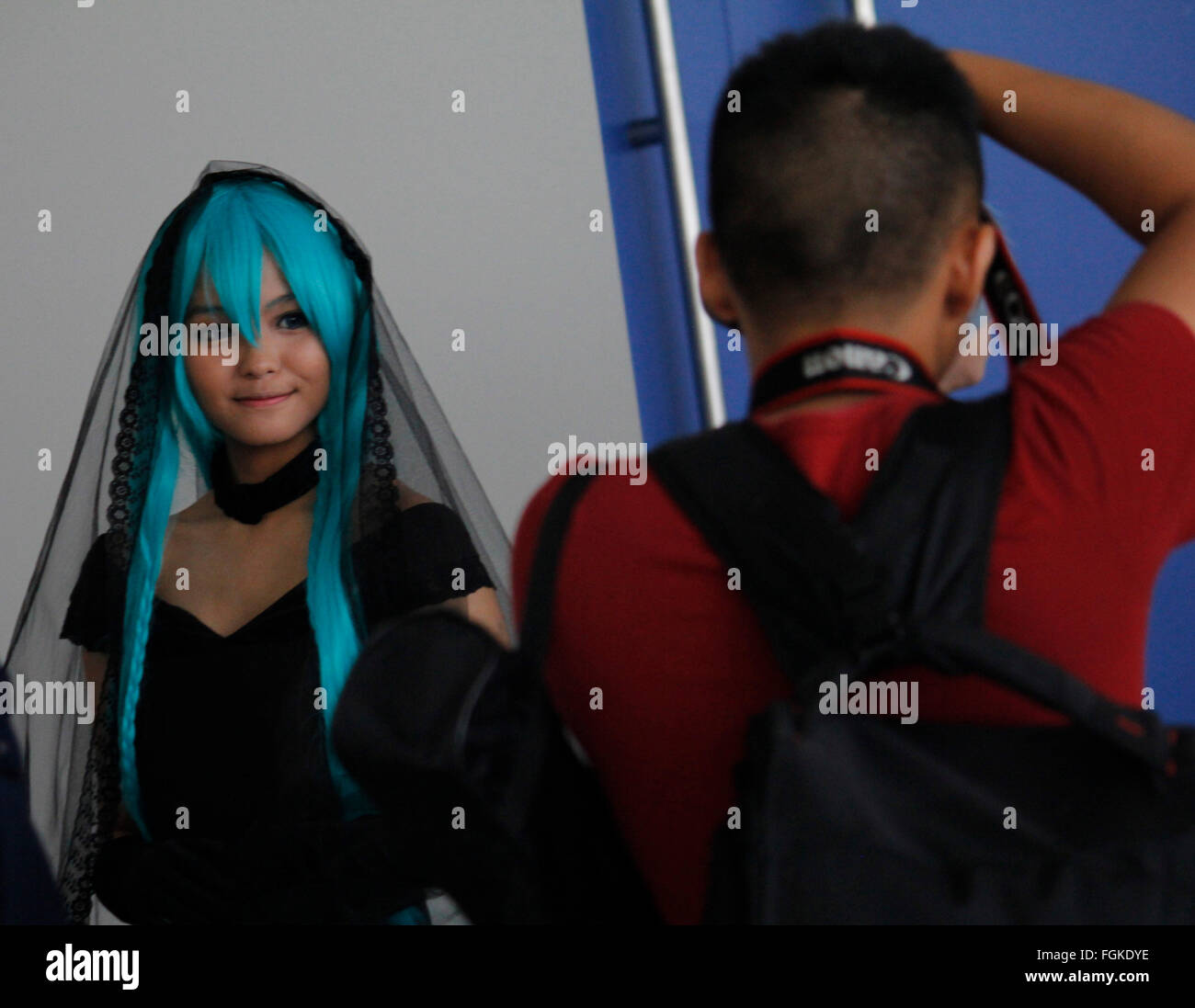 Pasay City, Philippines. 20th Feb, 2016. A cosplayer smiles for a ...