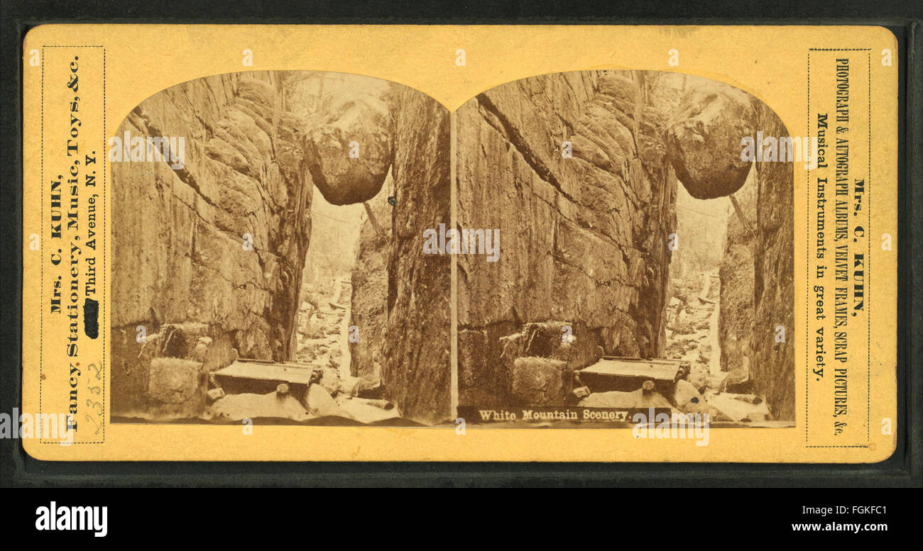 A photograph showing a suspended boulder in the Flume Gorge, Franconia ...