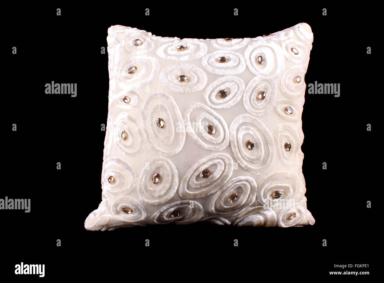 A luxurious pillow with gemstones and a white fabric with modern ...