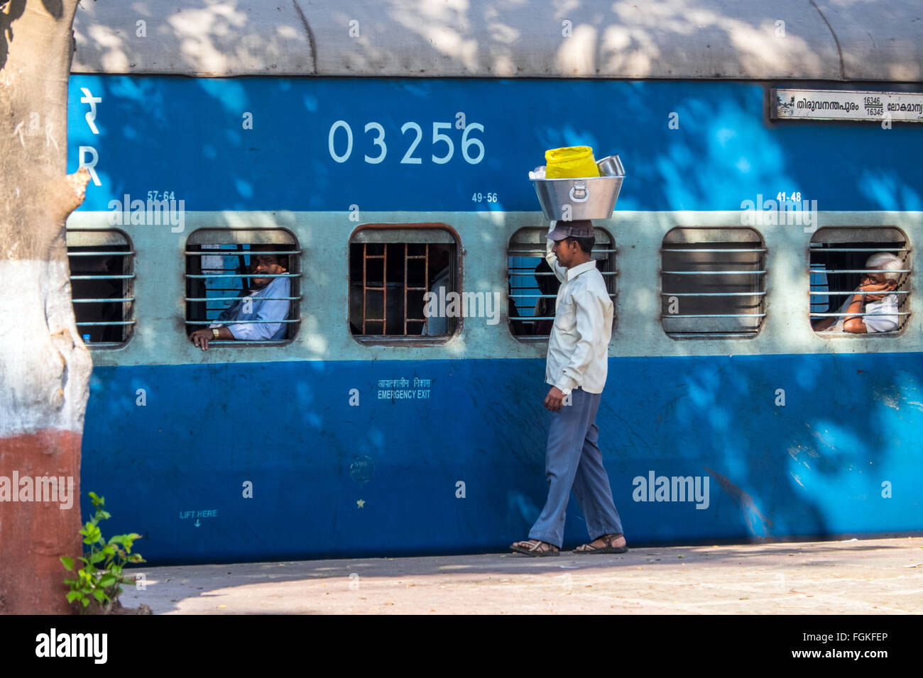 Vendor selling snacks to passengers on an Indian railways train Stock ...