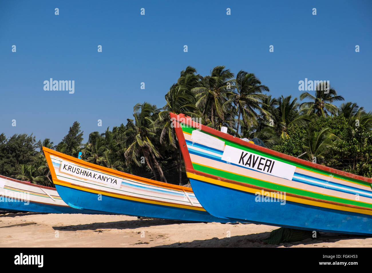 Traditional wooden fishing boats on a beach in Karnataka state ...