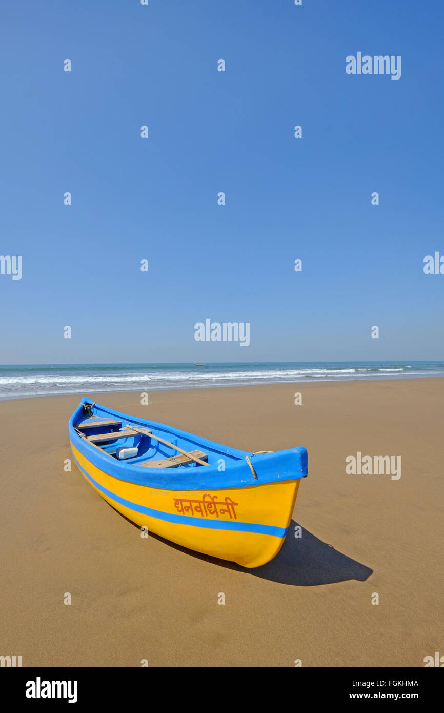 Traditional wooden fishing boats on a beach in Karnataka state ...