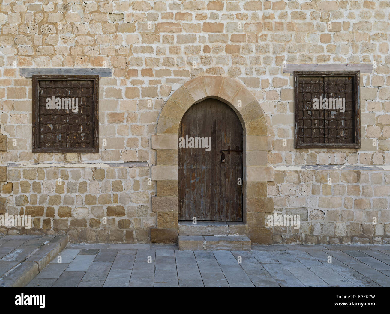 Door and two windows of one of the rooms surrounding the main yard of ...