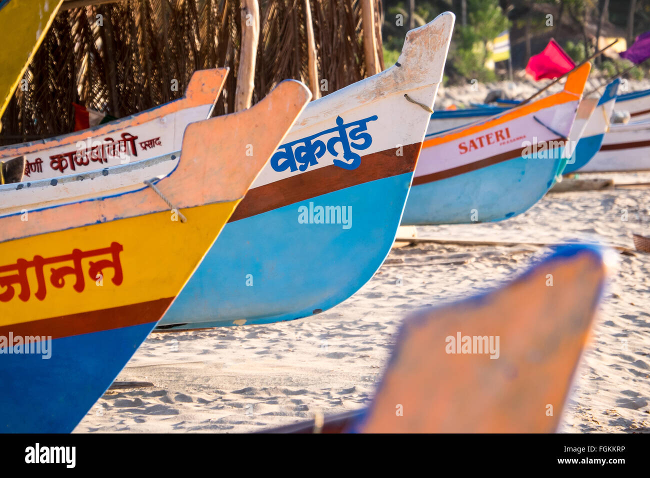 Traditional wooden fishing boats on a beach in Malvan, Maharashtra ...