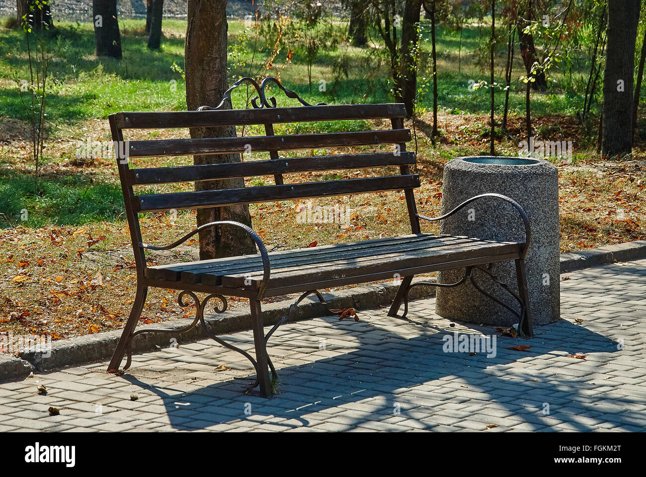 Old bench in a park in autumn time Stock Photo - Alamy