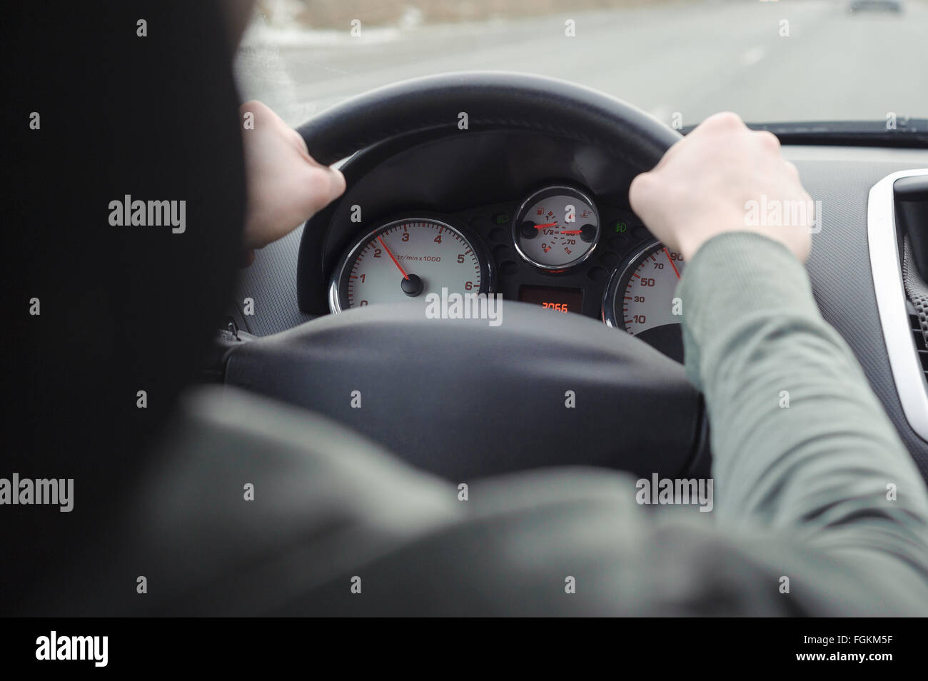 Man driving a car. Hands on steering wheel of a car Stock Photo - Alamy