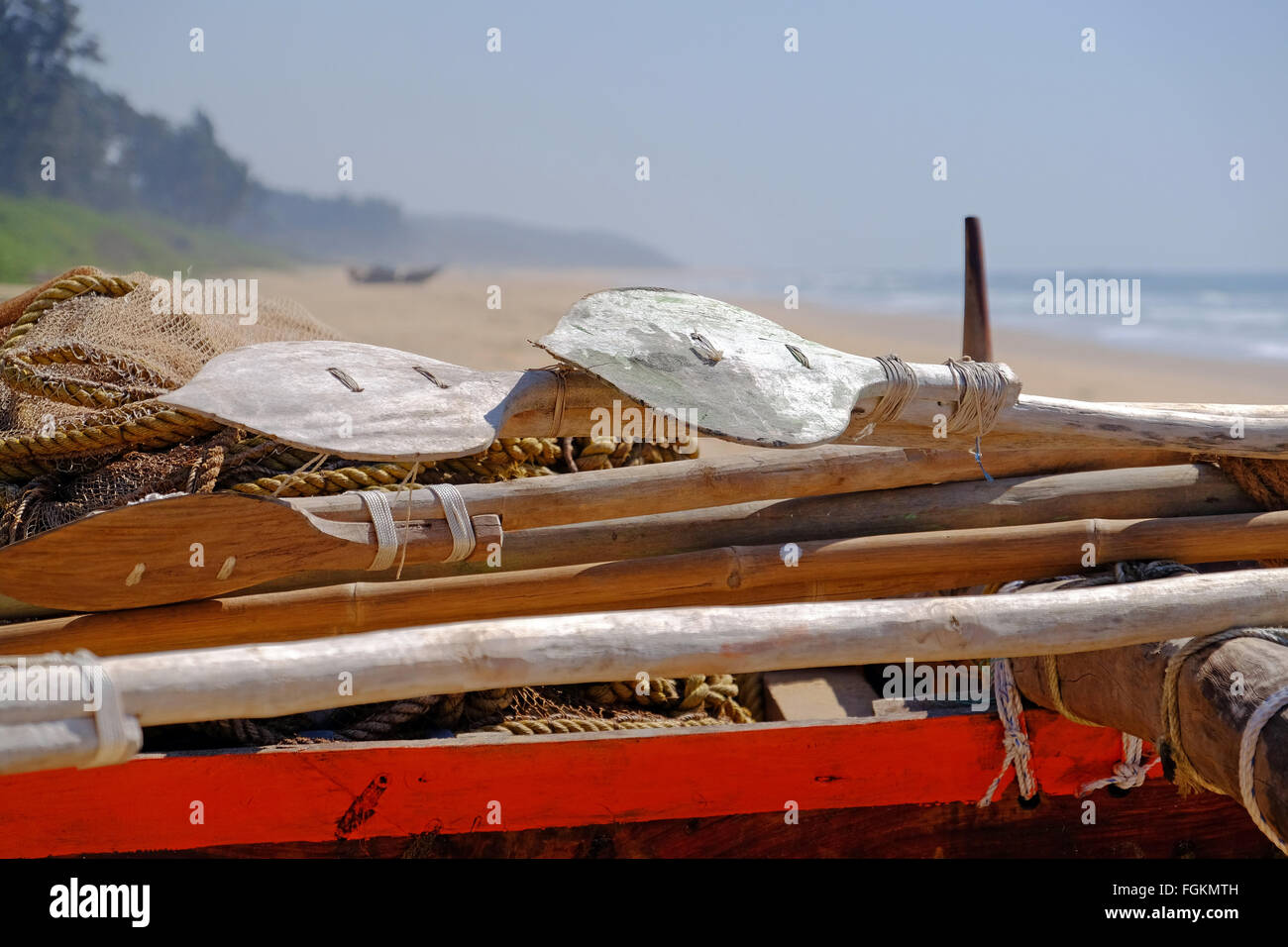 Traditional wooden fishing boats on a beach in Maharashtra state ...