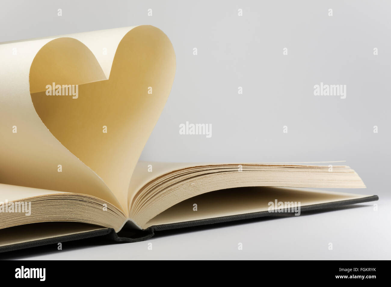 Book with two pages in a heart shape Stock Photo - Alamy