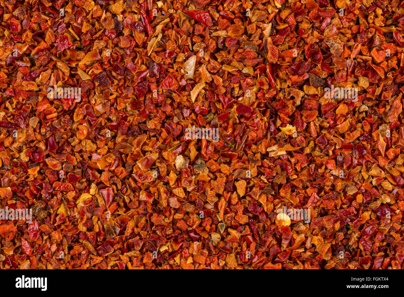 Crushed red chili pepper for background texture Stock Photo - Alamy