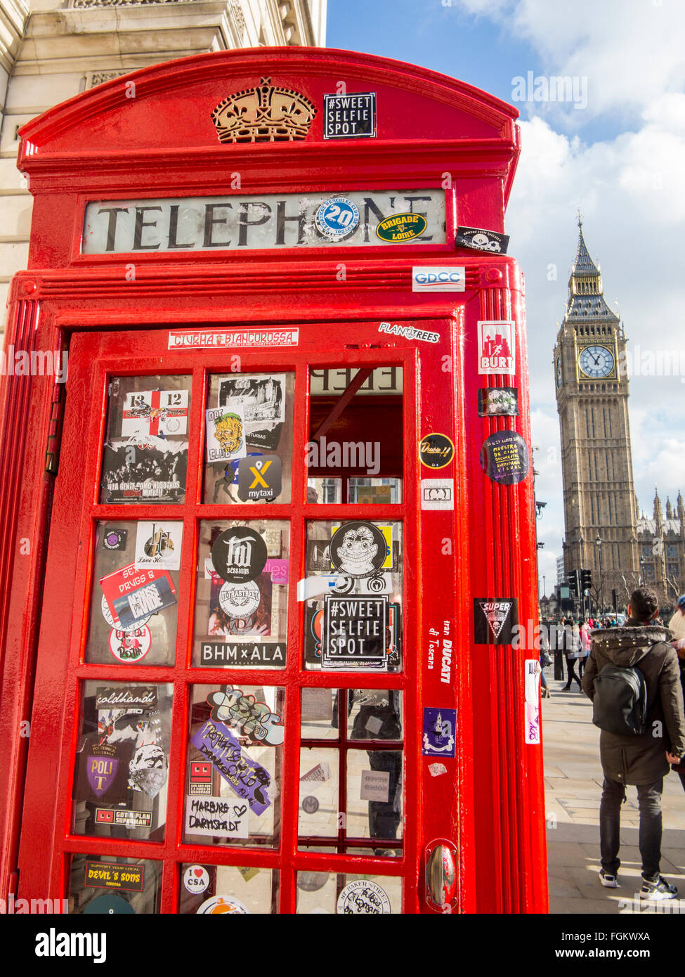 Stickers cover a phone box in London Stock Photo - Alamy