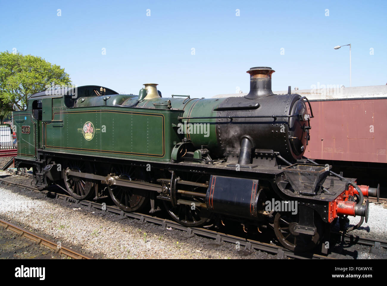 A steam engine in British rail way livery, running on the west Somerset ...