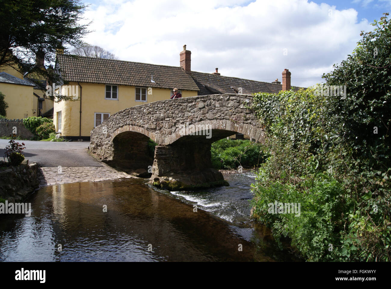 two arched stone bridge, with ford as an alternative, over a small ...