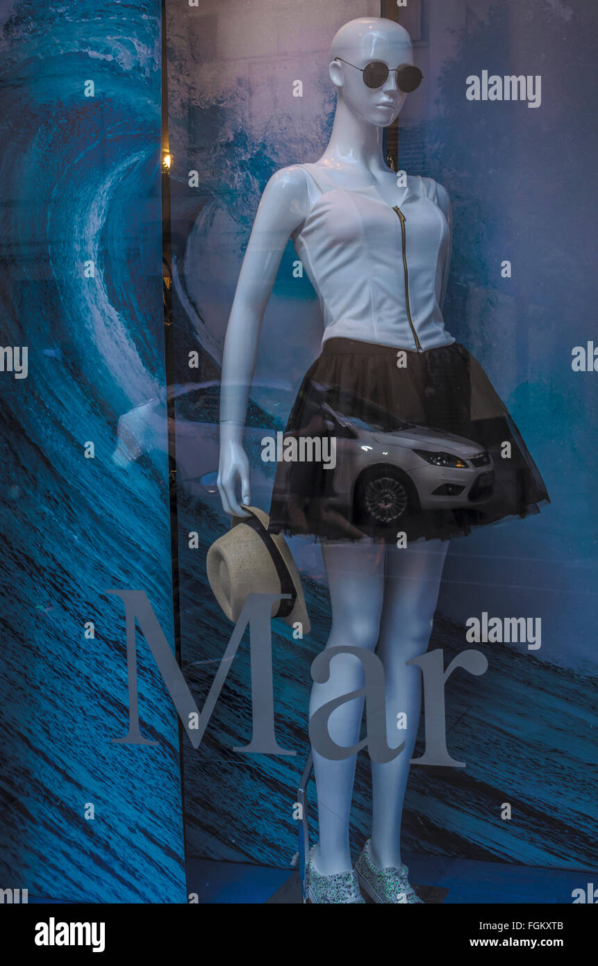 View of a model in a window shop of a central street of Madrid city ...