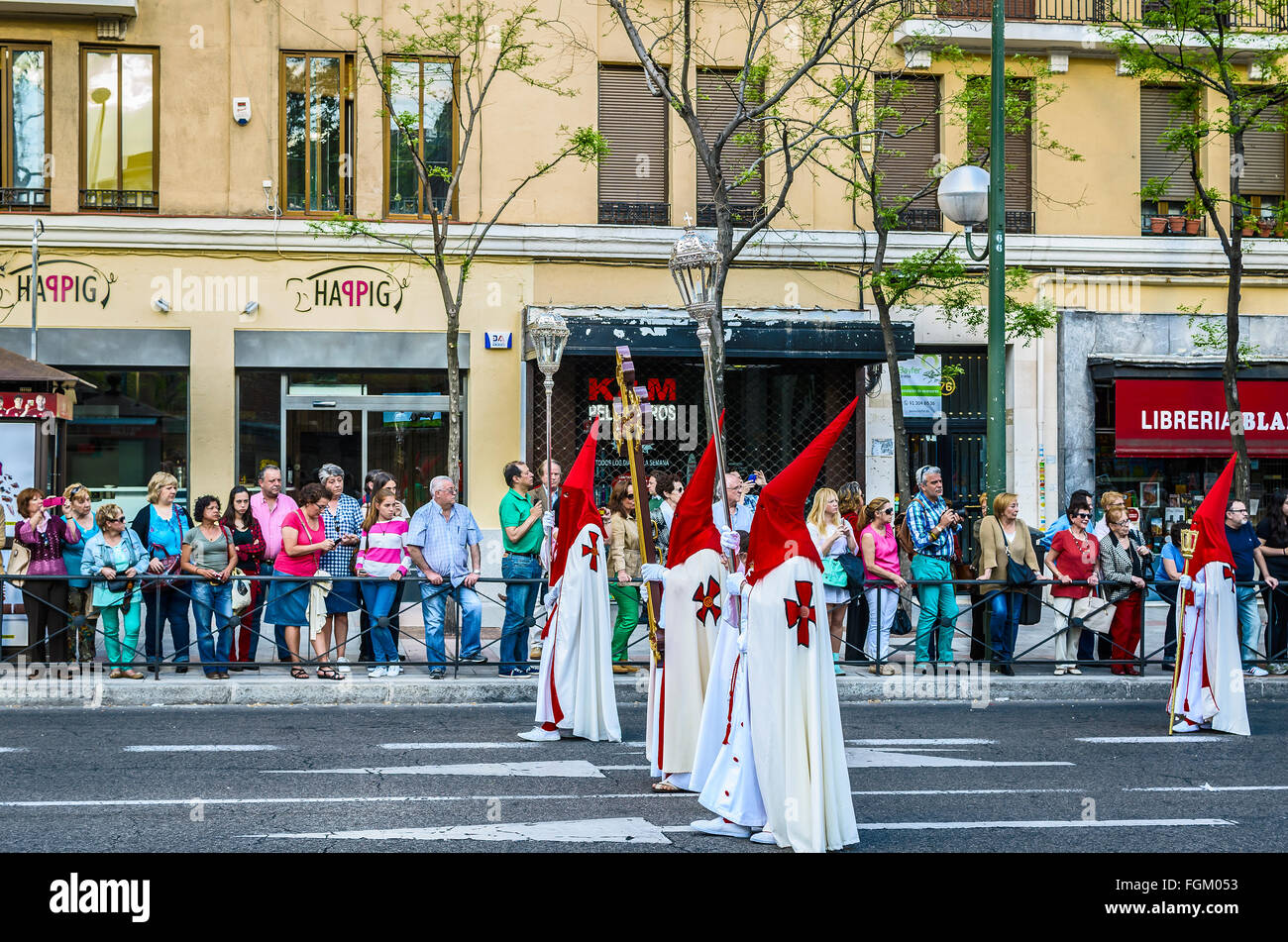 A religious procession running by a central street of Madrid city ...