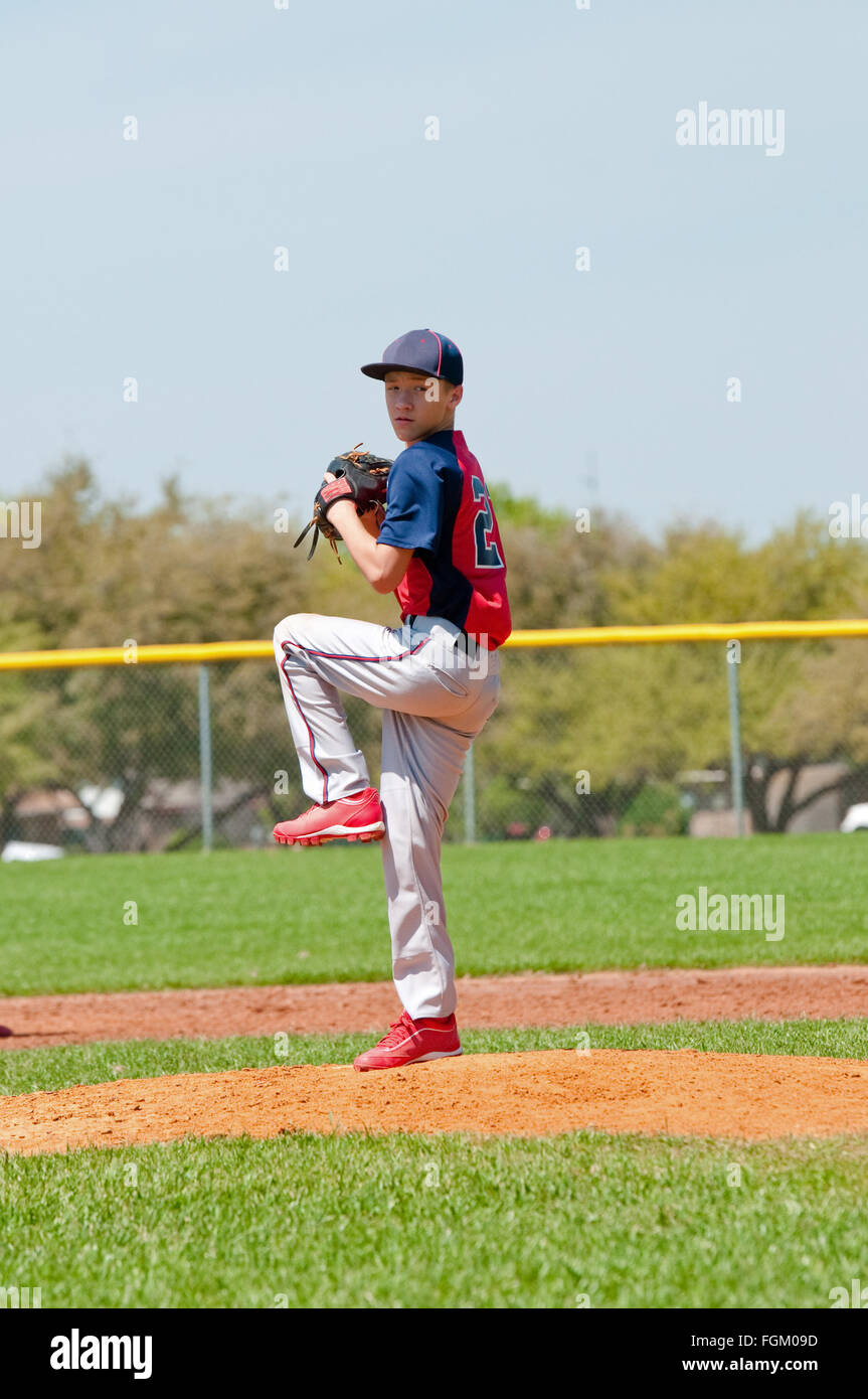 Teen boy baseball pitcher about to throw a pitch Stock Photo - Alamy